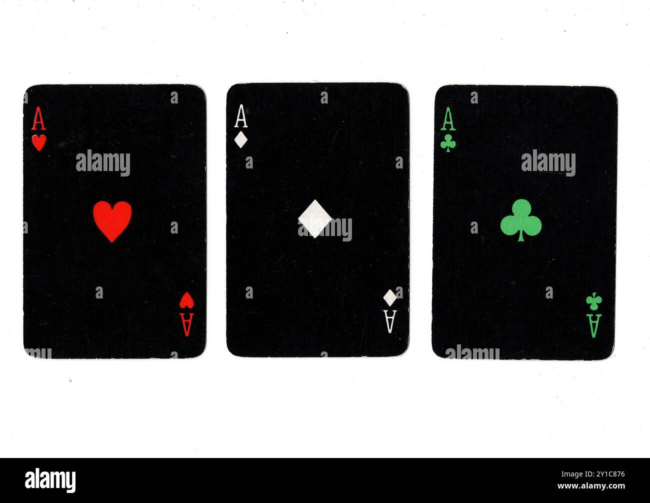 Vintage black playing cards showing three aces on a white background ...