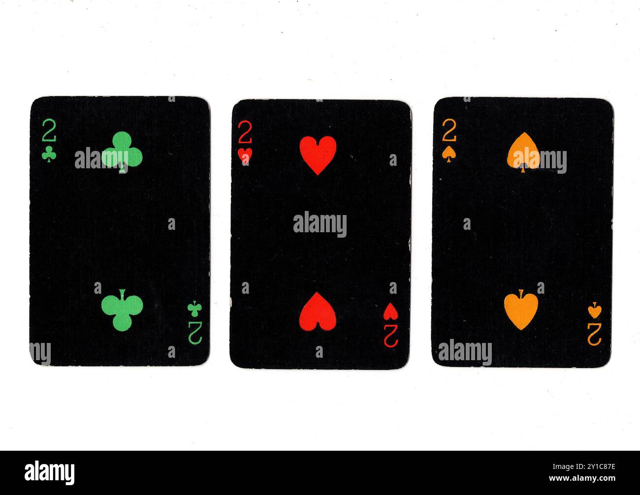 Vintage black playing cards showing three twos on a white background ...