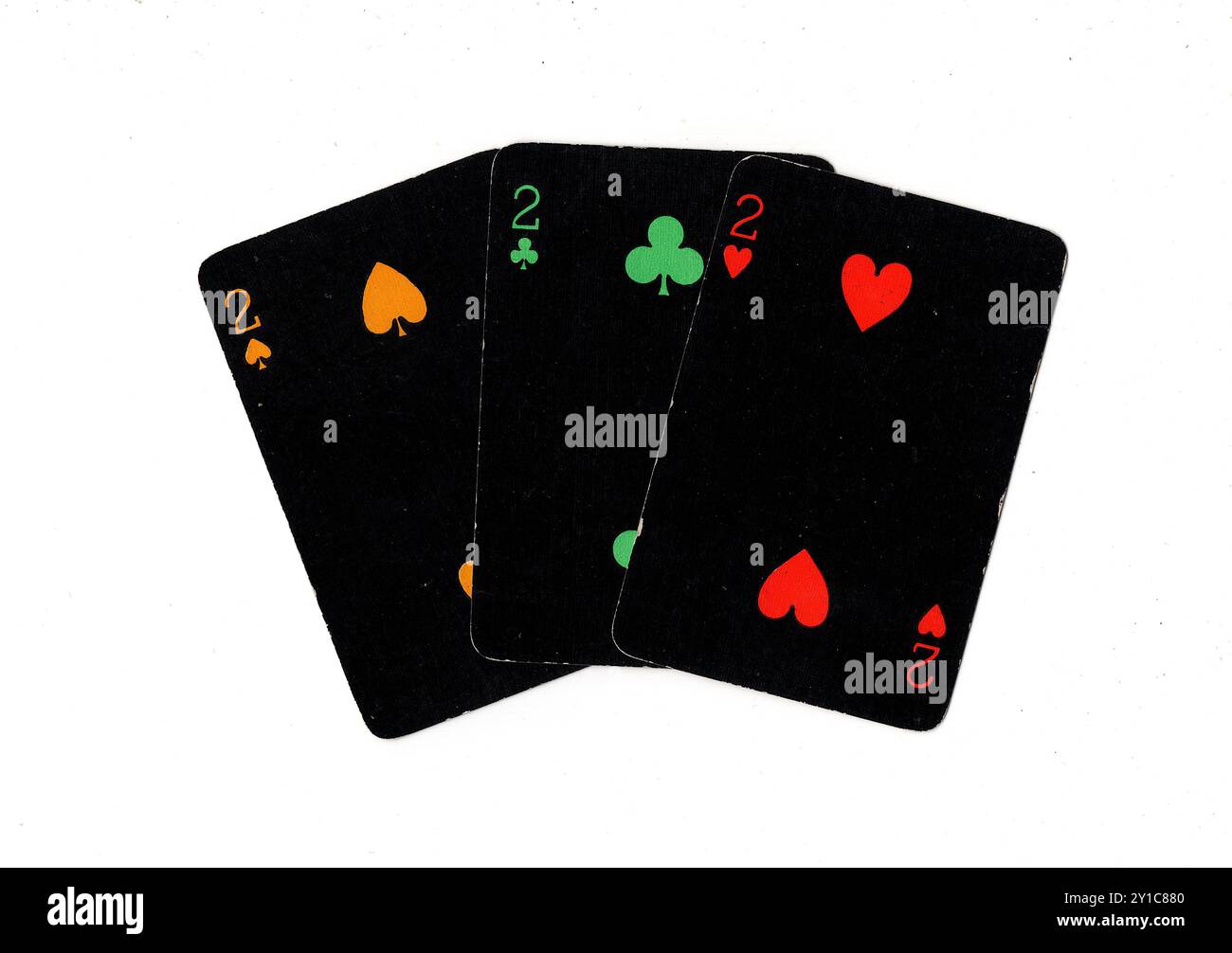 Vintage black playing cards showing three twos on a white background ...