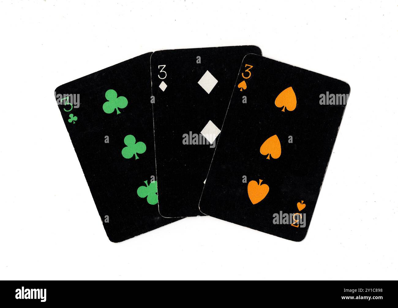 Vintage black playing cards showing three threes on a white background ...