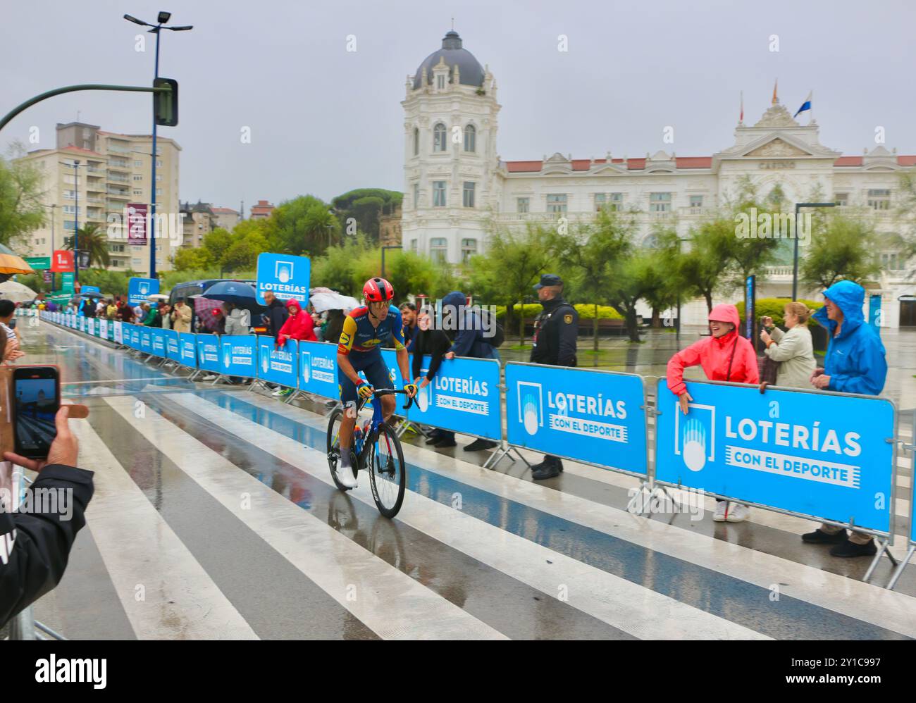 Cyclists competing in the 17th stage of the Vuelta de Espana in pouring ...