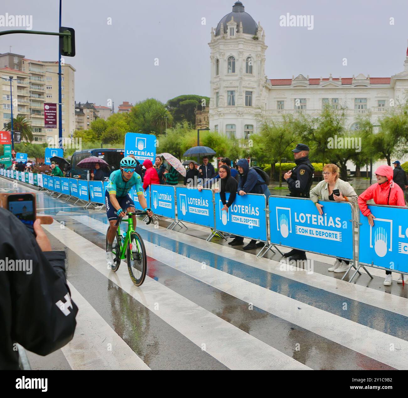 Cyclists competing in the 17th stage of the Vuelta de Espana in pouring ...