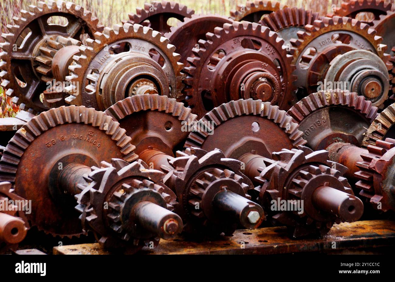 Collection of rusty gears and mechanical components outdoor Stock Photo ...