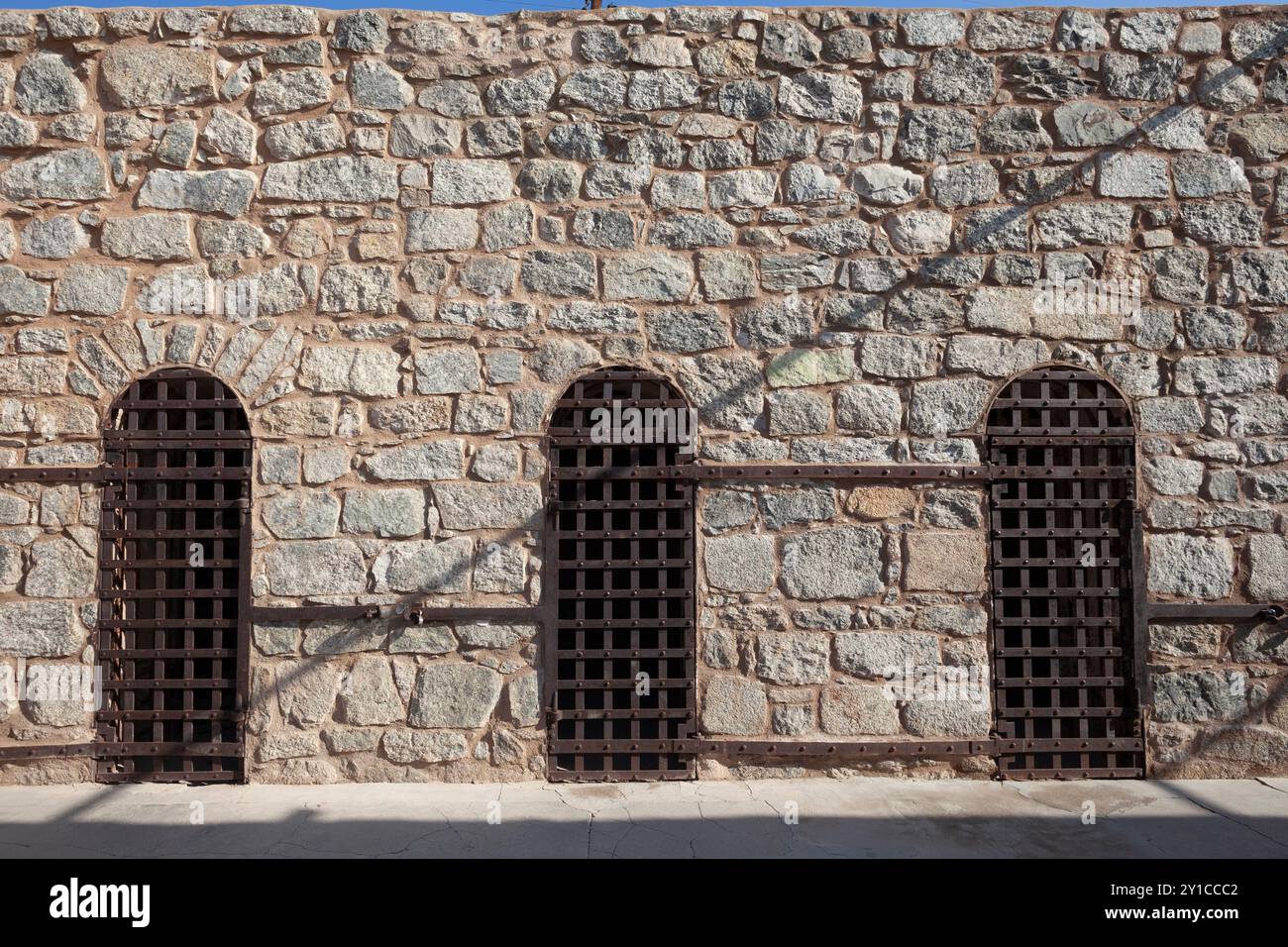 Yuma Territorial Prison rock walls and iron gates Stock Photo - Alamy