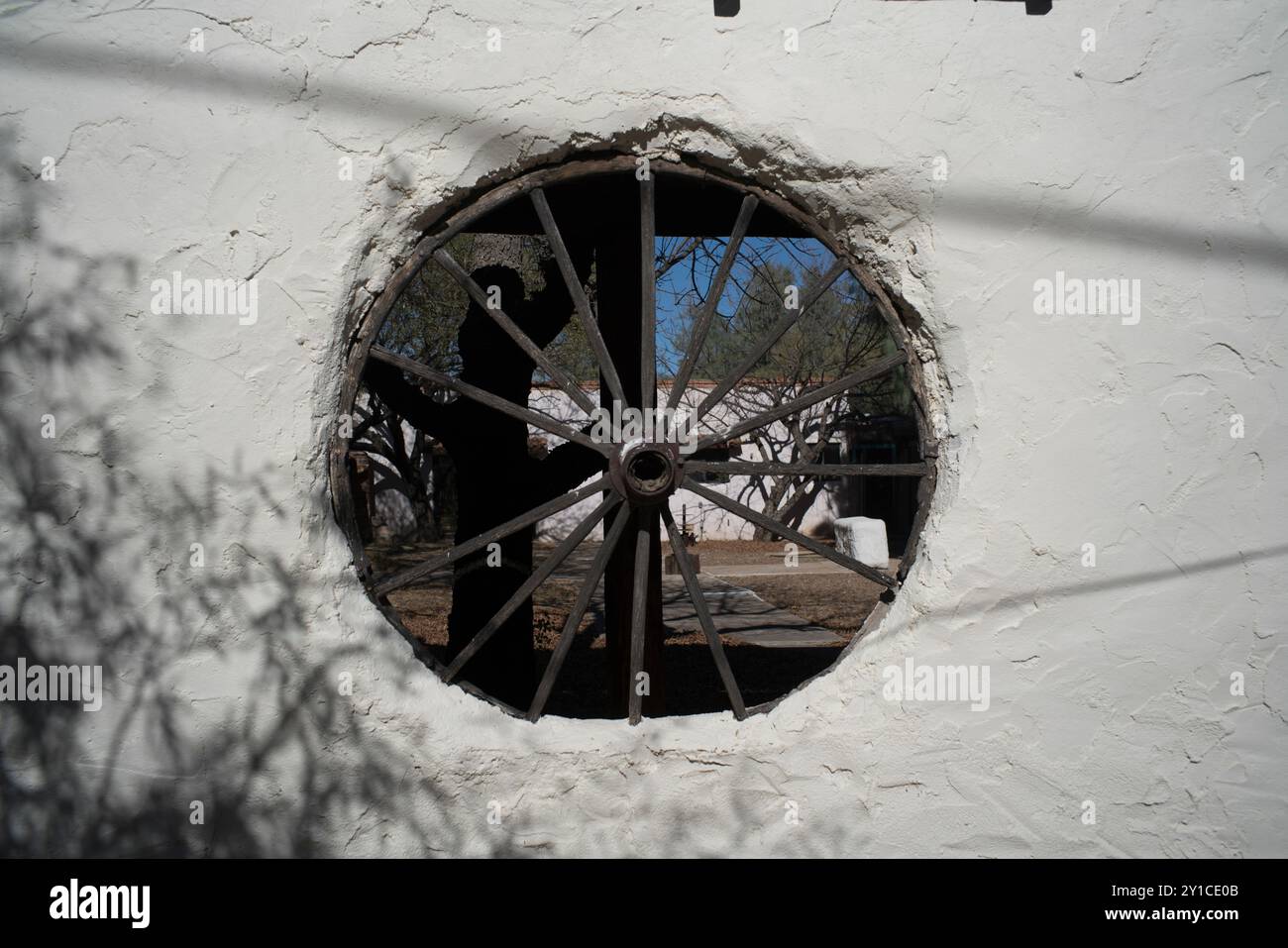 A wagon wheel window in stucco wall Tubac, AZ Stock Photo - Alamy