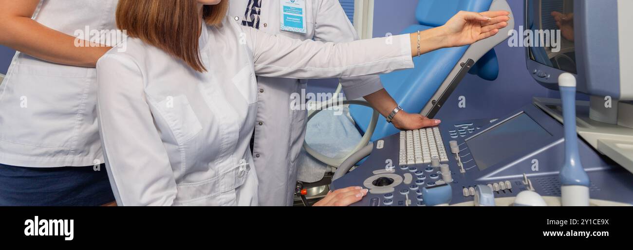 Medical professionals gather to analyze and discuss ultrasound results ...