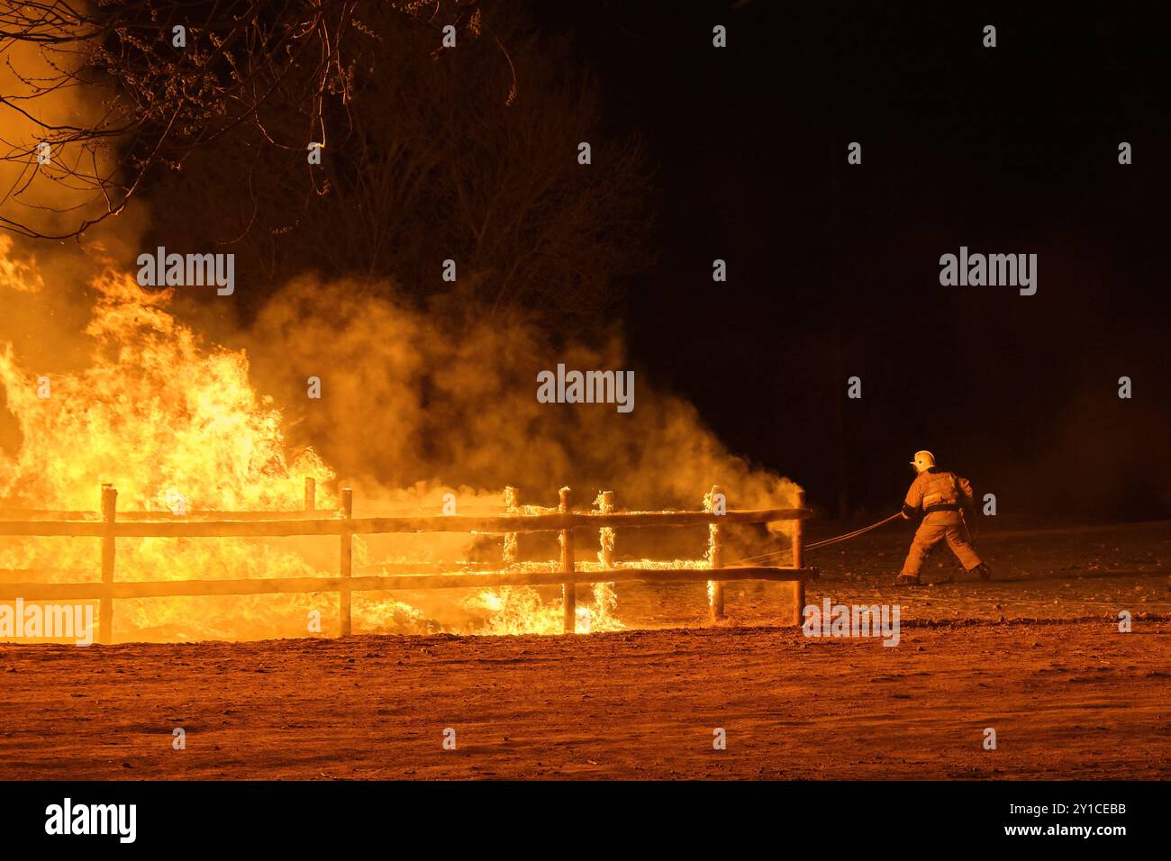 Extinguishing fire wooden house hi-res stock photography and images - Alamy
