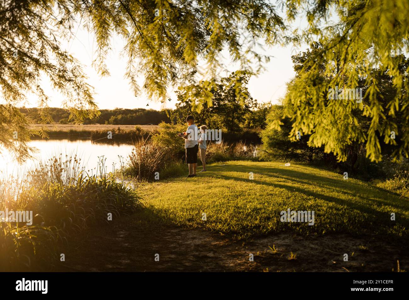 Father And Son Fish Together In Rural Oklahoma Stock Photo - Alamy