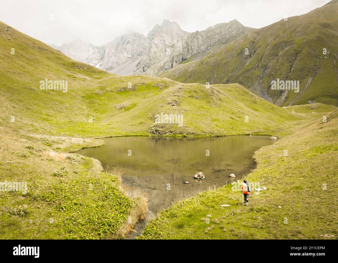 Aerial tracking view fit sporty healthy woman trekking in majestic ...