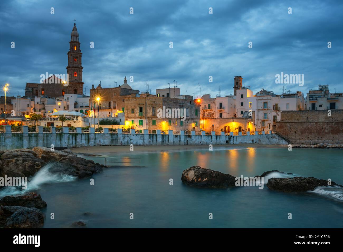 Monopoli traditional italian village and beach at sunset, in Italy ...