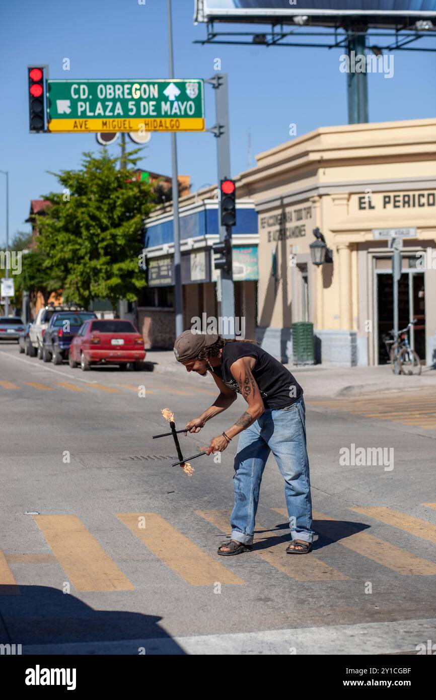 A street performer with fire sticks in Mexico Stock Photo - Alamy
