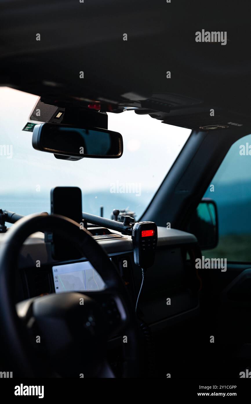 View through windshield of featuring phone, radio, and navigation map ...