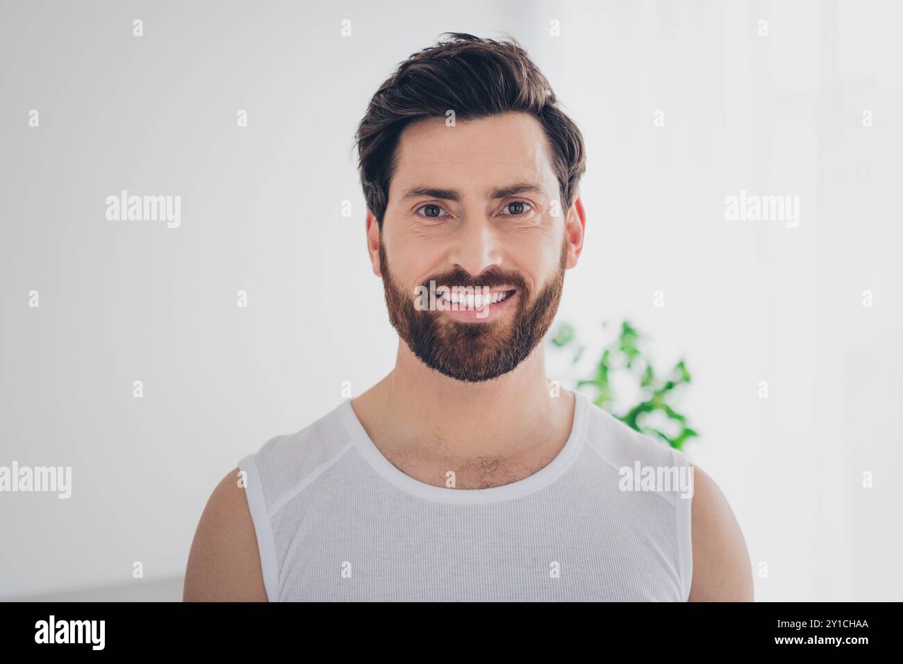 Photo of attractive nice athletic strong bearded man indoors house home ...