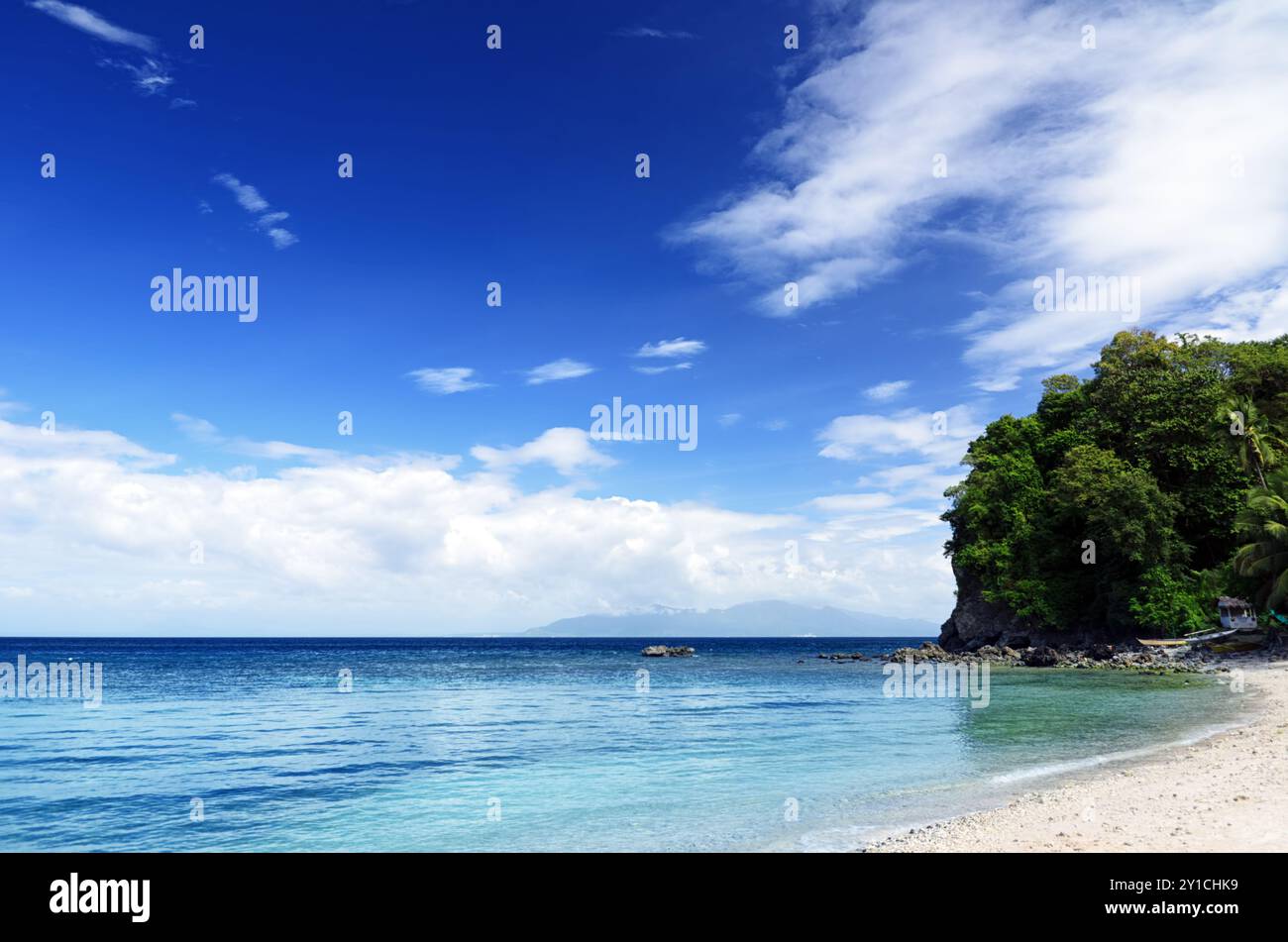 Blue sky and clear water. The White Beach, Puerta Galera, Philippines ...