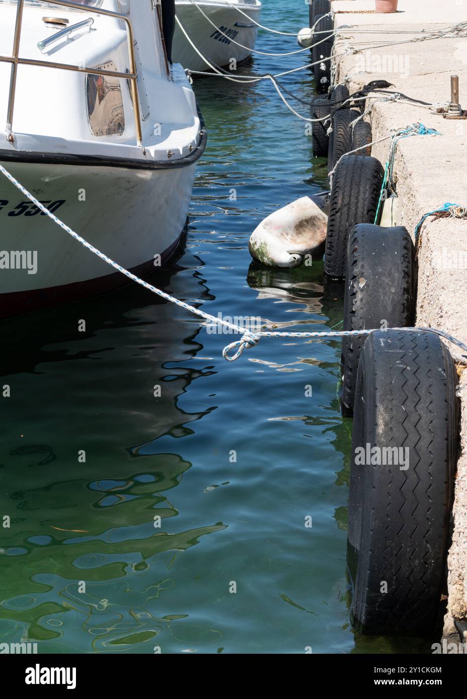 Dock bumpers, car tires on dock Stock Photo - Alamy