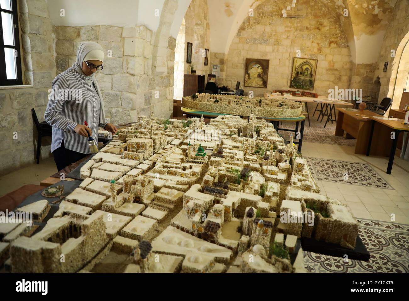 Artist Nora Jardaneh, from Nablus, designs models of the city of Nablus ...
