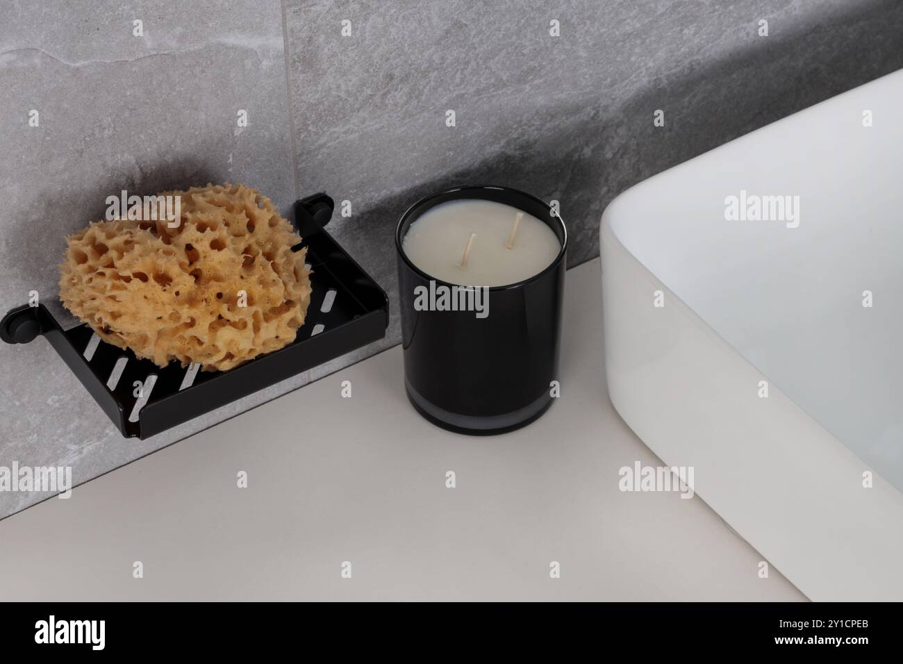 Modern Sponge Holder and Candle in Minimalist Bathroom Stock Photo - Alamy