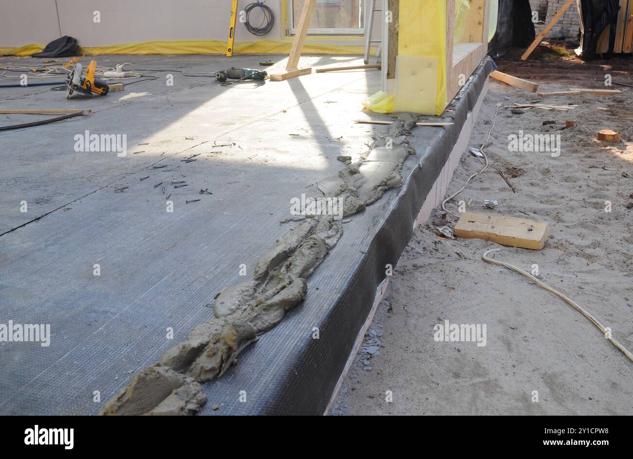 Close up on waterproofing slab-on-grade foundation, monolithic slab ...