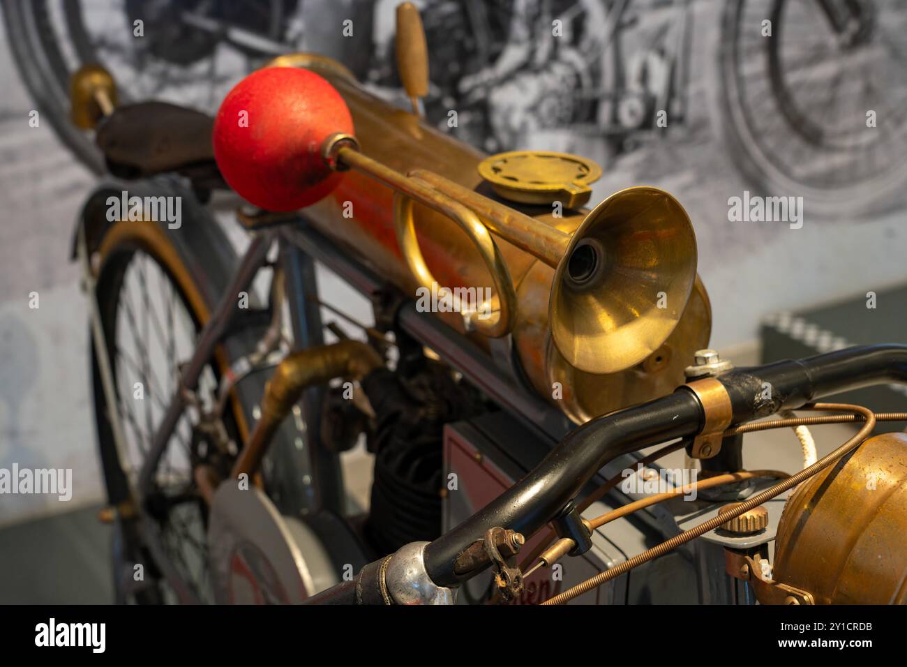 Detail of the brass horn on a vintage 1902 Clement motorcycle in the ...