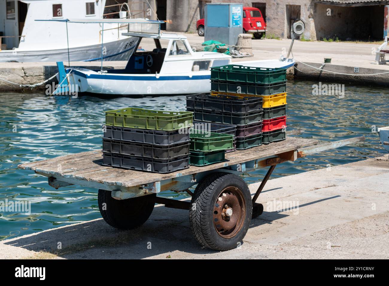 Pile of plastic crates various colors on trailer Stock Photo - Alamy