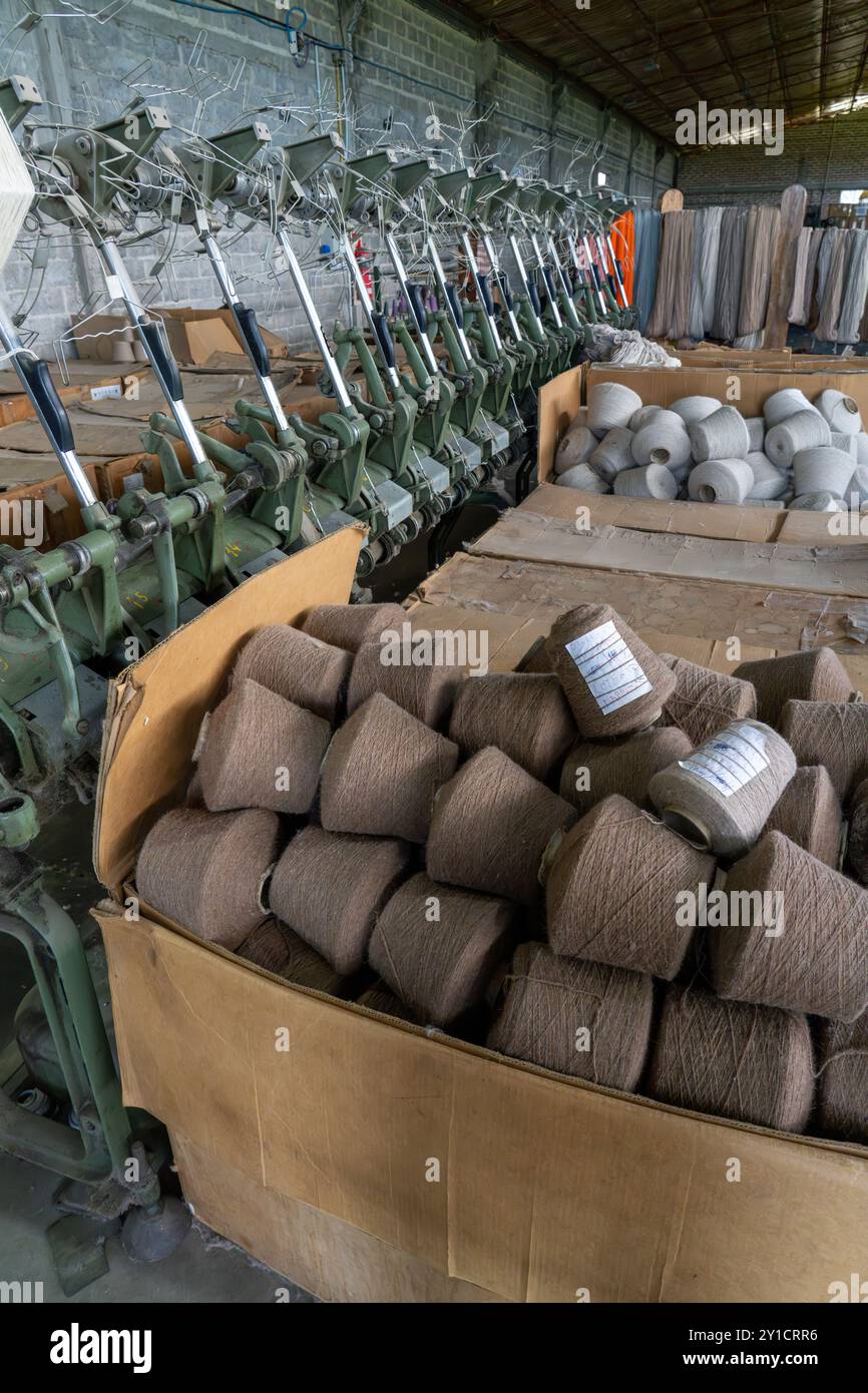 Large spools of llama wool yarn for weaving at Hilandería Warmi, a ...