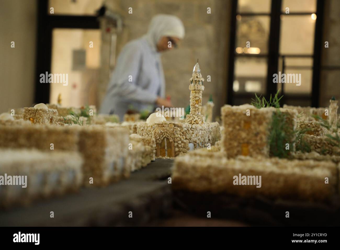 Artist Nora Jardaneh, from Nablus, designs models of the city of Nablus ...