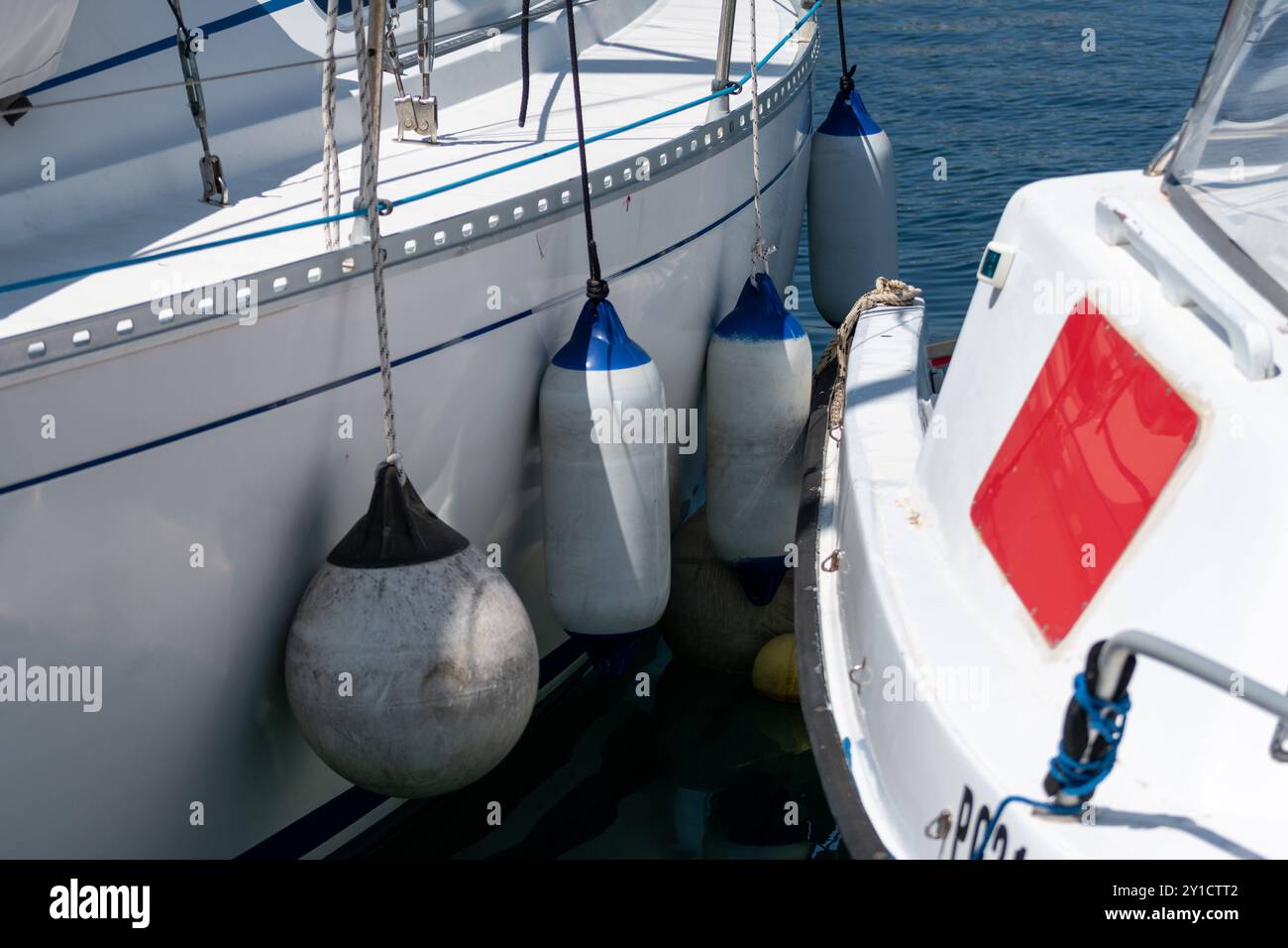 Fender buoy between two boats, anti collision protection Stock Photo ...