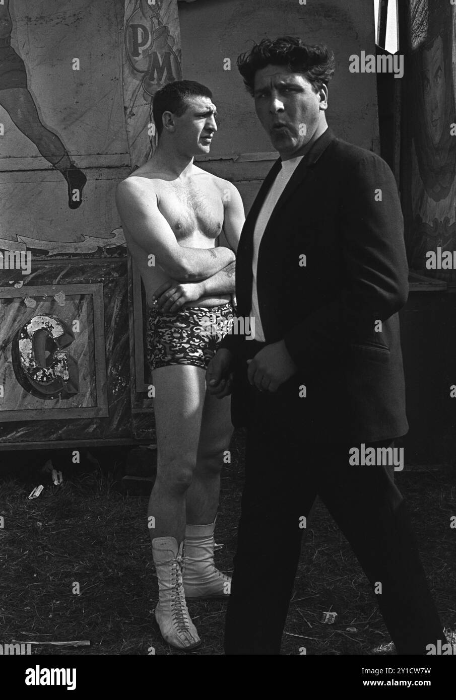 Prize Fighter, standing outside Pat McKeowen's fairground boxing booth ...