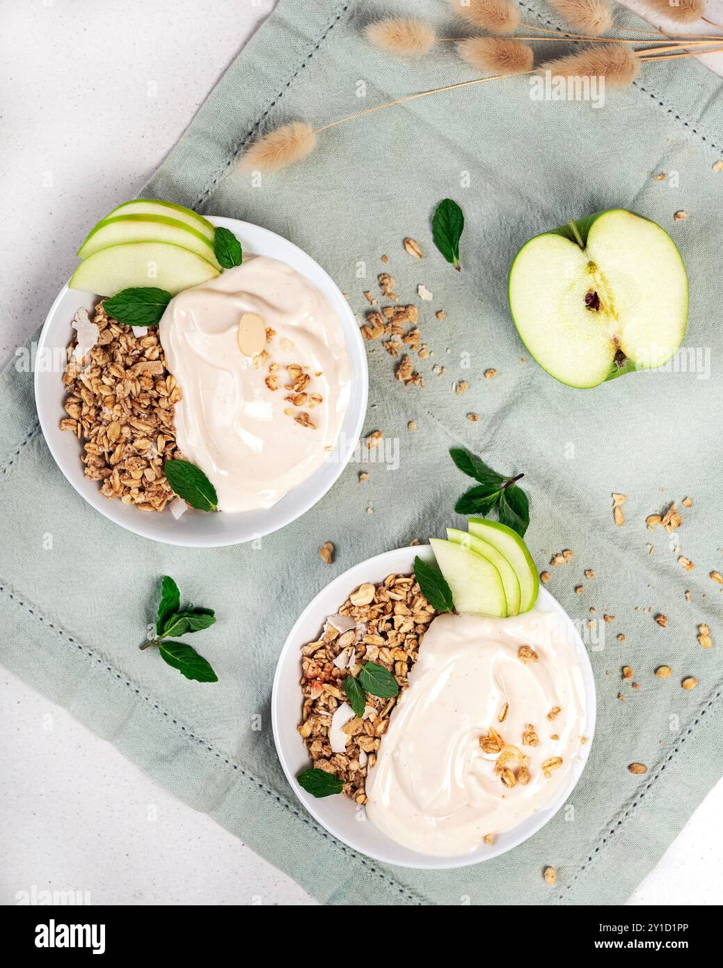 Apple crumble flavoured yoghurt served with muesli and fresh apples ...