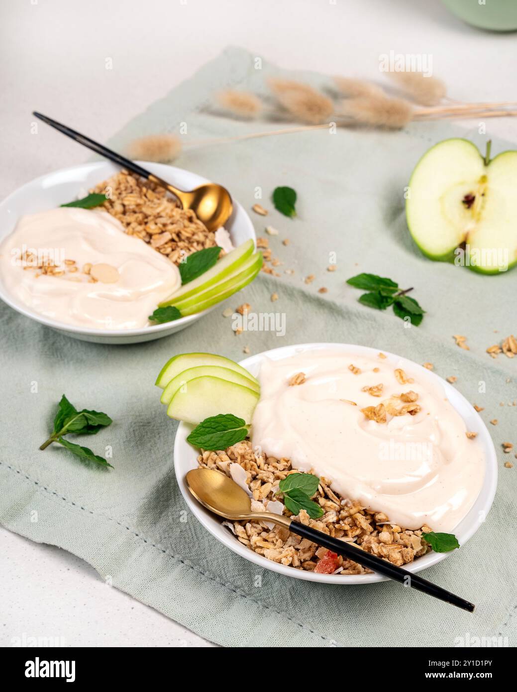 Apple crumble flavoured yoghurt served with muesli and fresh apples ...