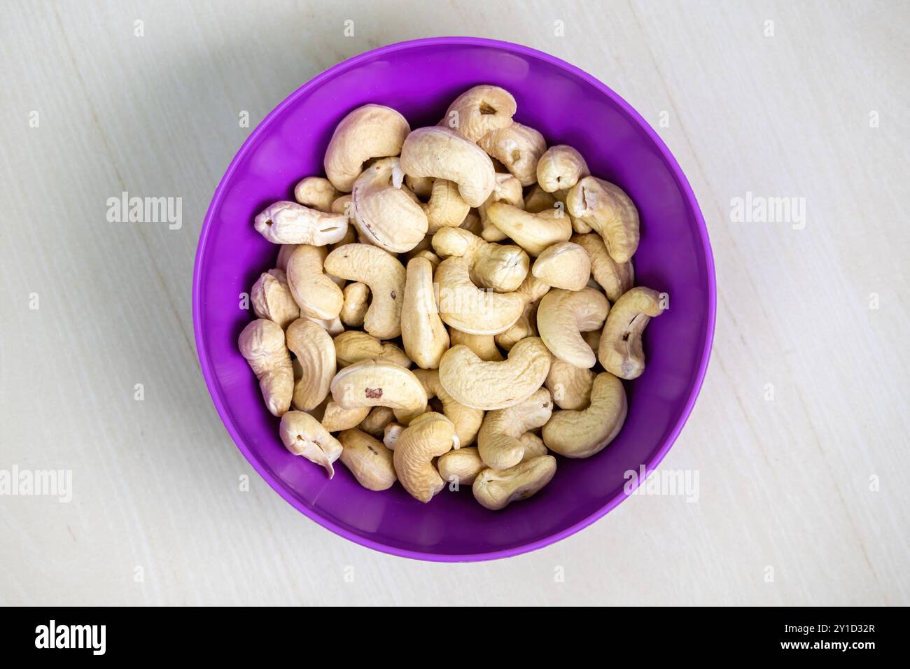 Healthy cashew nuts (Anacardium occidentale) in a bowl on wooden ...