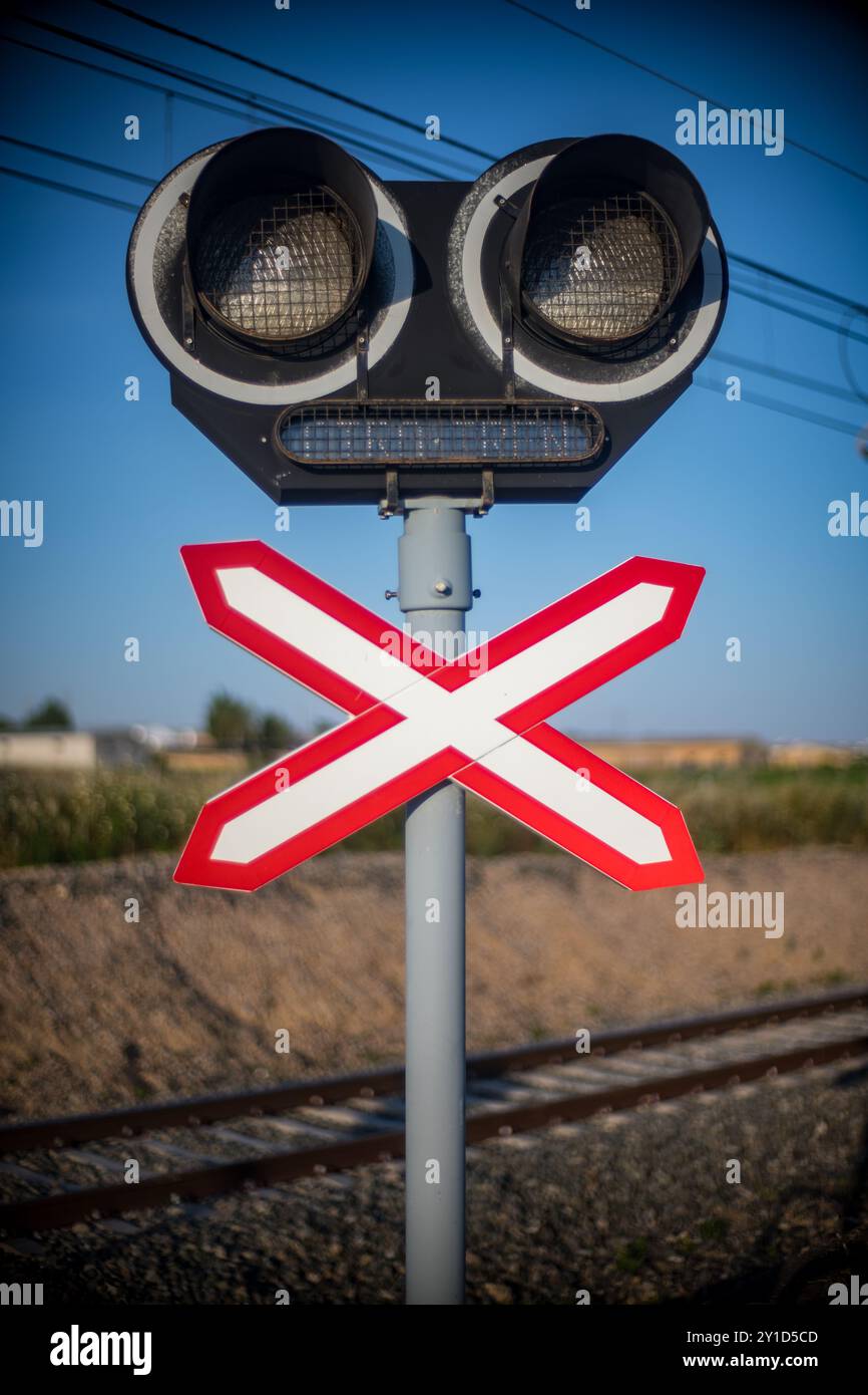 Close up image of a railroad crossing sign, symbolizing caution and ...