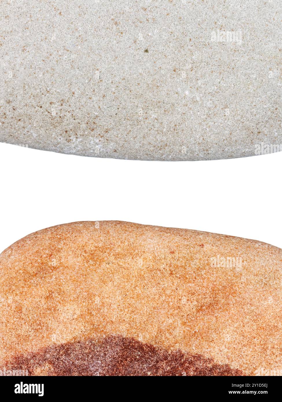Edges of two pebbles isolated on white background with a space for text ...