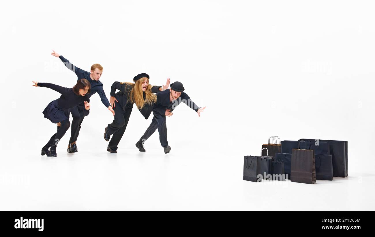 Group of people all in black outfits showing readiness to run, racing ...