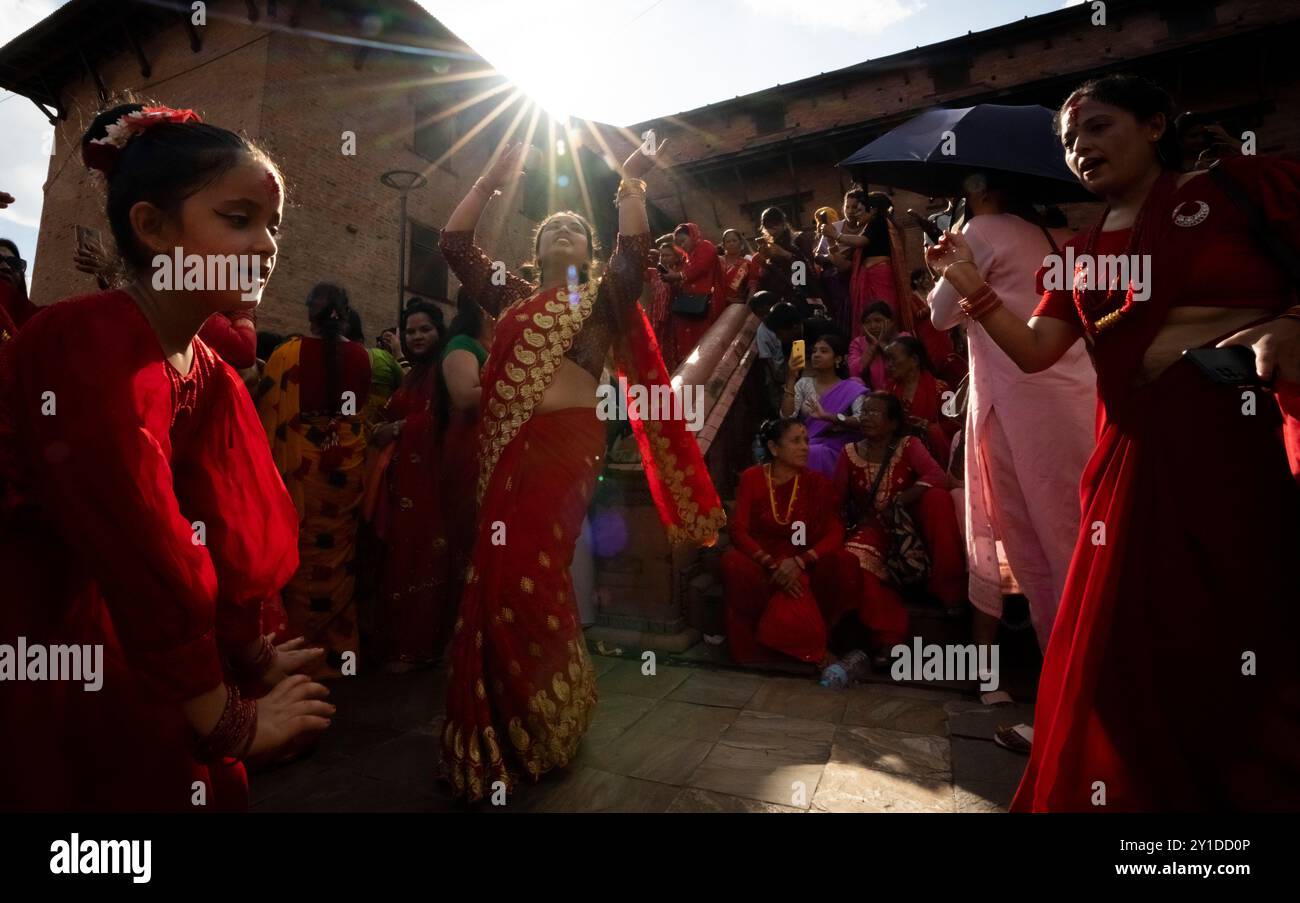 Nepalese women dance at the Pashupatinath temple during Teej festival ...