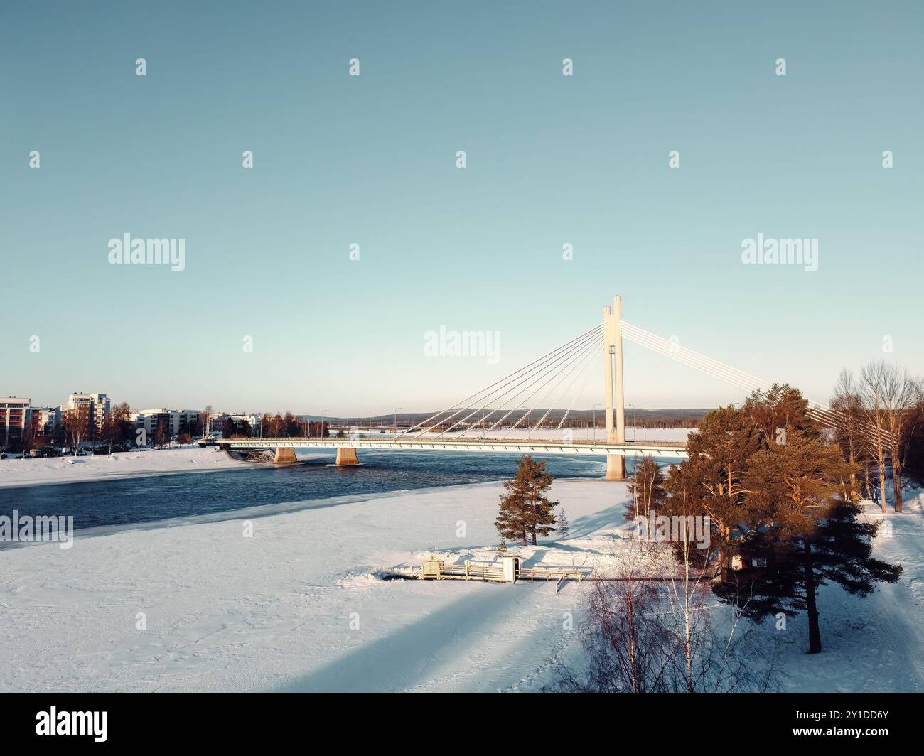 Lumberjack Candlestick bridge over frozen river in Rovaniemi, Lapland ...