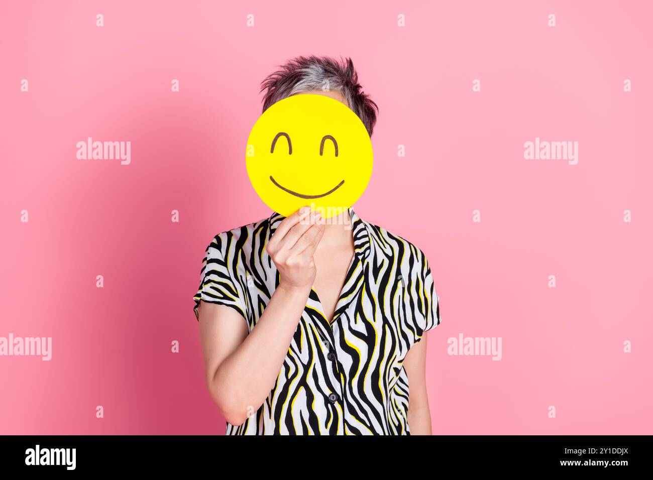 Photo of nice aged woman smiley emoji cover face wear zebra print shirt ...