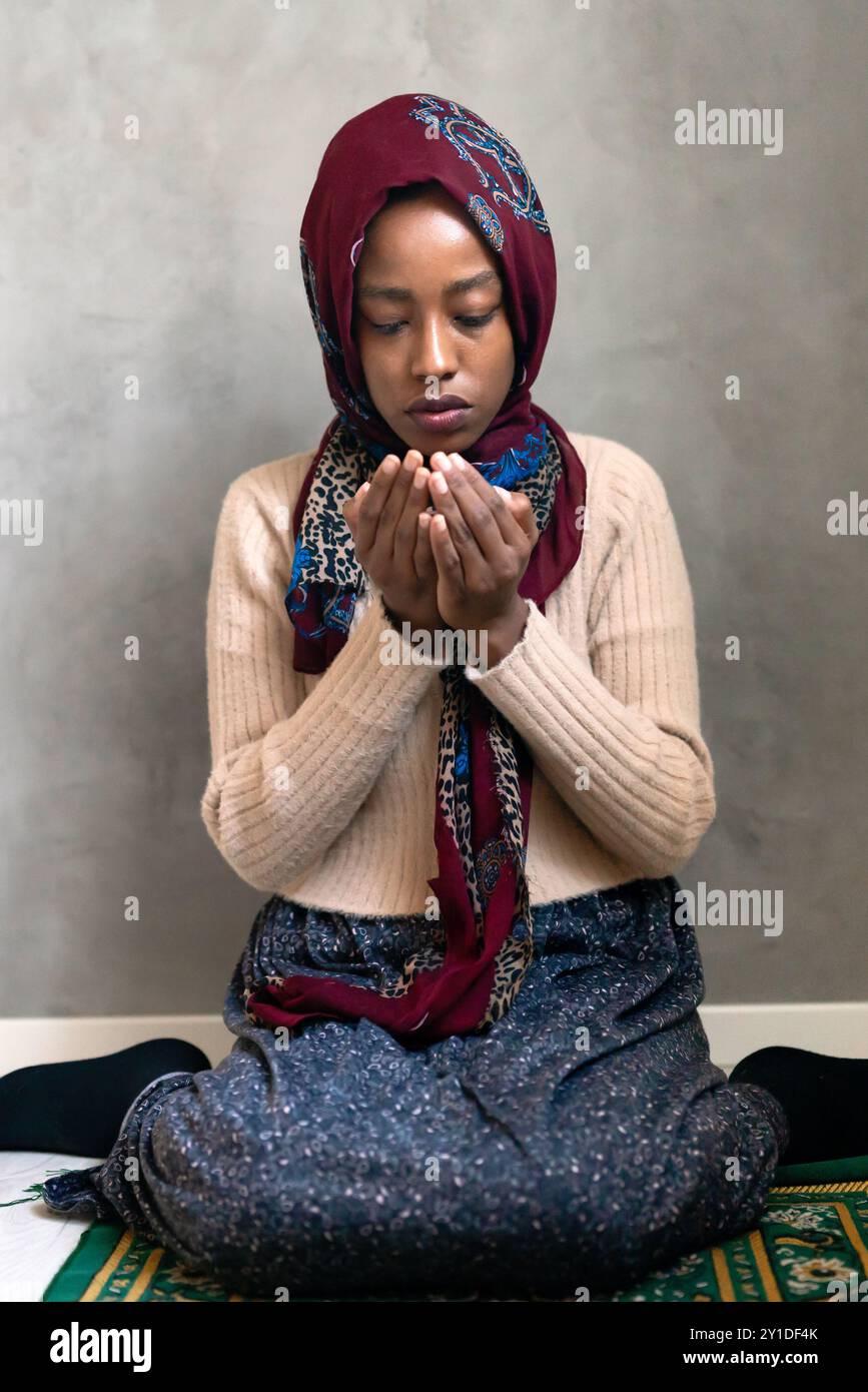 Young muslim woman praying. Islam, muslim religion concept Stock Photo ...