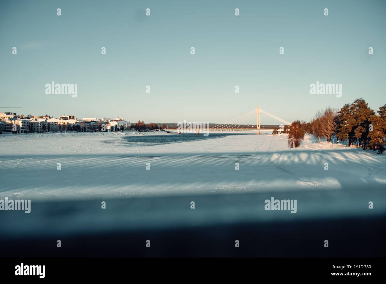 Mostly frozen Ounasjoki river under candlestick bridge in Rovaniemi ...