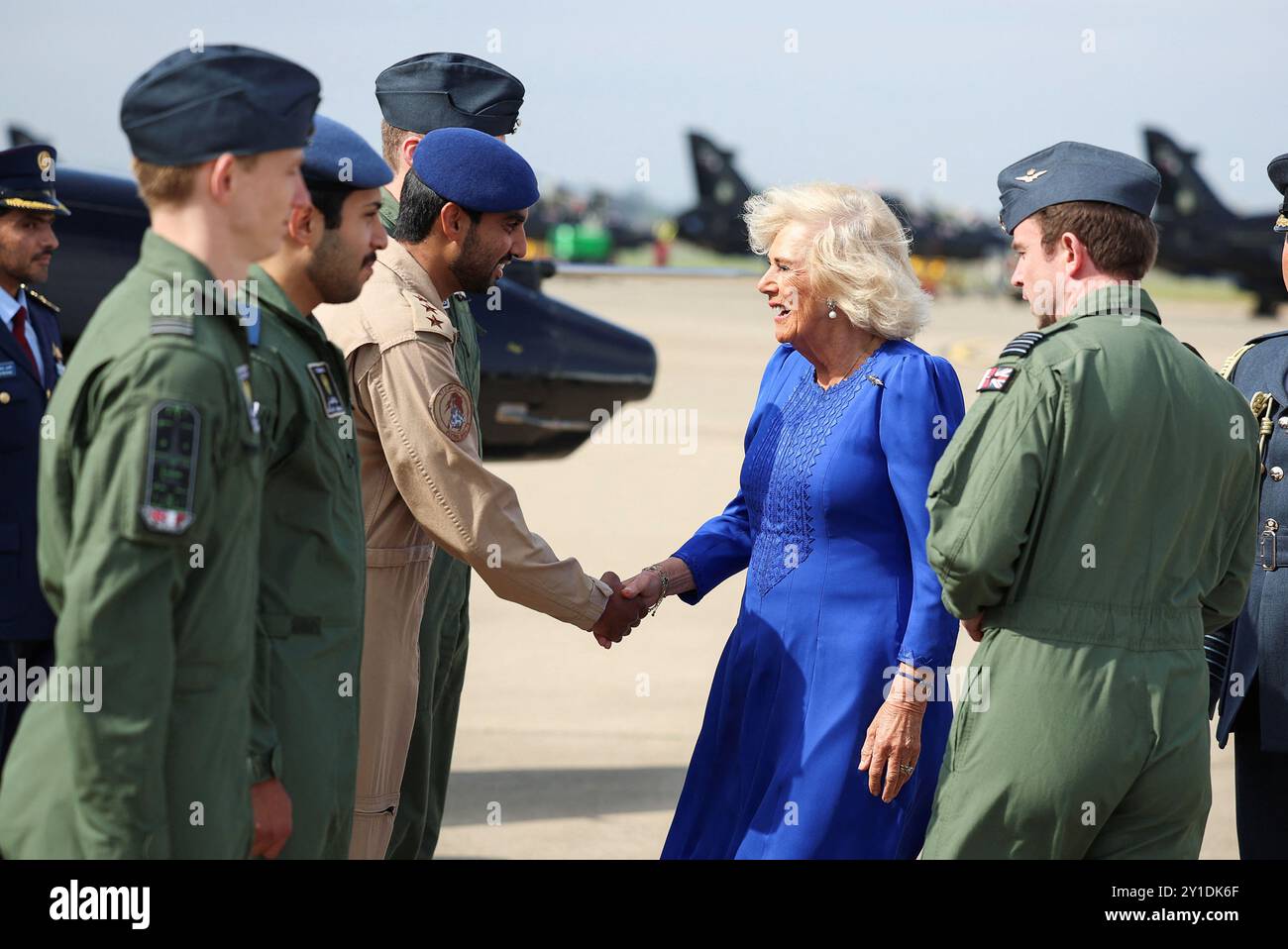 Queen Camilla, Honorary Air Commodore, shakes hands with a pilot from the Qatar Emiri Air Force ...