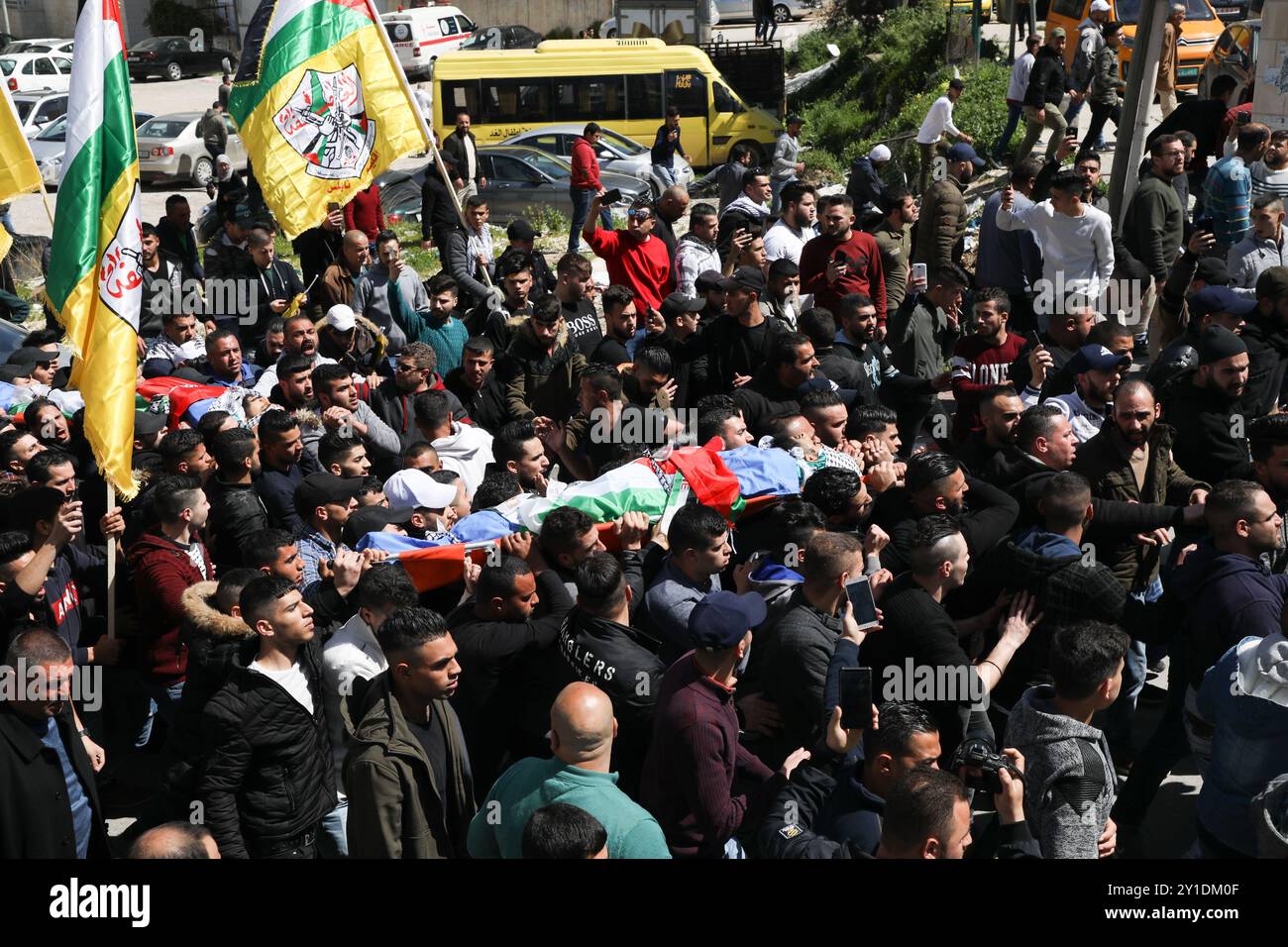 Nablus, Palestine, 20th March 2019. Mourners carry the bodies of Zaid ...