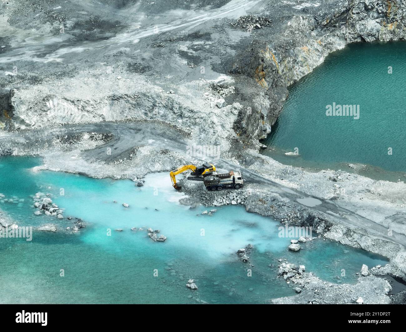 Open pit mine industry. Limestone quarry with backhoe and truck in ...