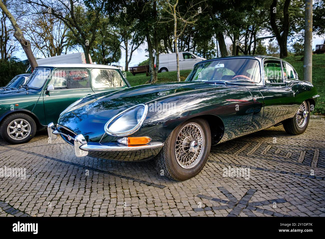 Lisbon, Portugal - Jan 20, 2024: A classic dark green E-Type Jaguar Series 1 coupe car with ...