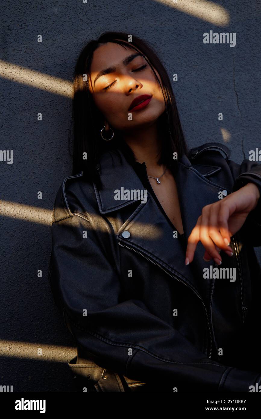 Woman catching the sun's rays in the first days of autumn Stock Photo ...