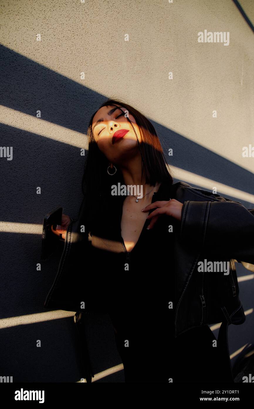 Woman catching the sun's rays in the first days of autumn Stock Photo ...