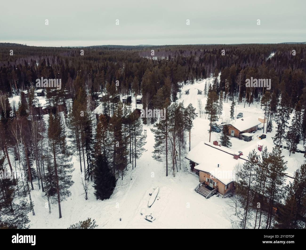 Wooden cabins in snowy forest in winter in Rovaniemi, Lapland Stock ...