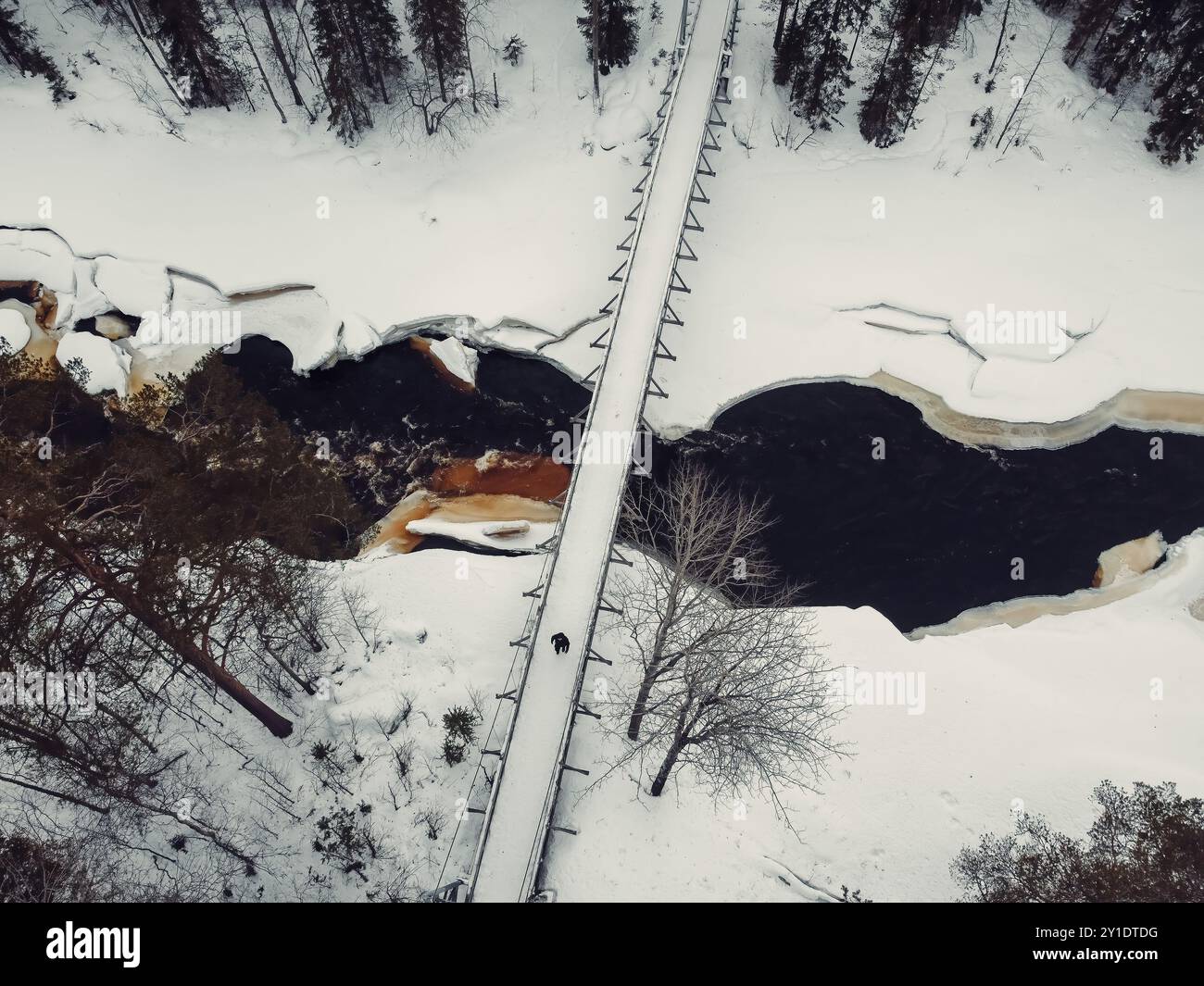 Half frozen arctic river in the snow shot from above in Rovaniemi ...
