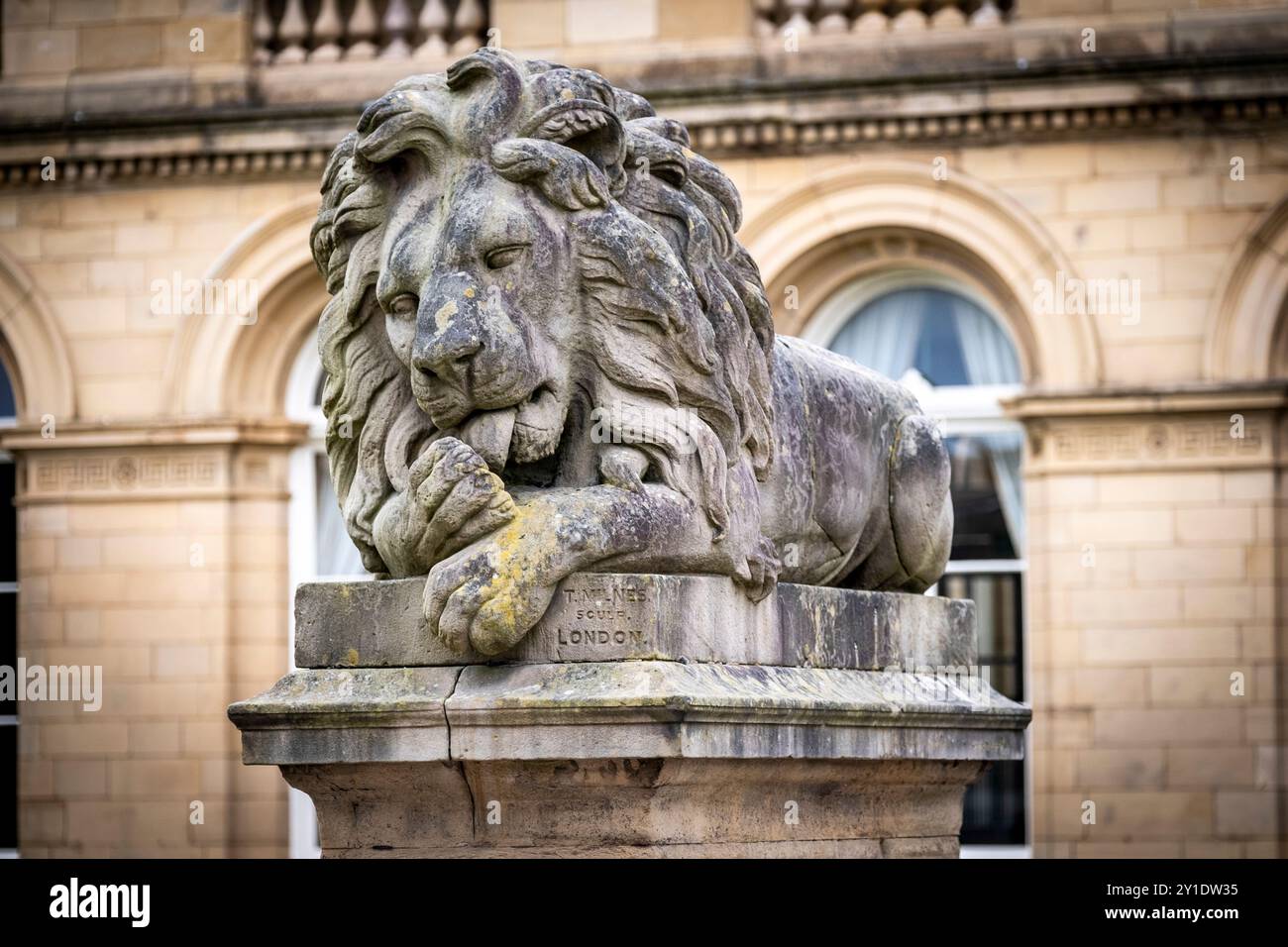 Stone carving of a Lion outside Victoria Hall, Saltaire model village ...