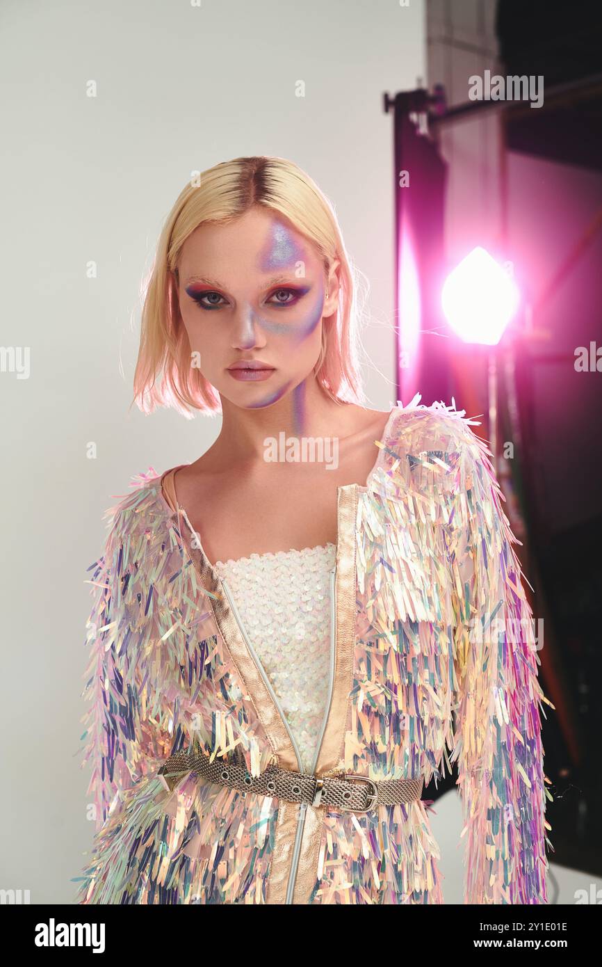 A stylish young woman showcases holographic fashion in a vibrant ...