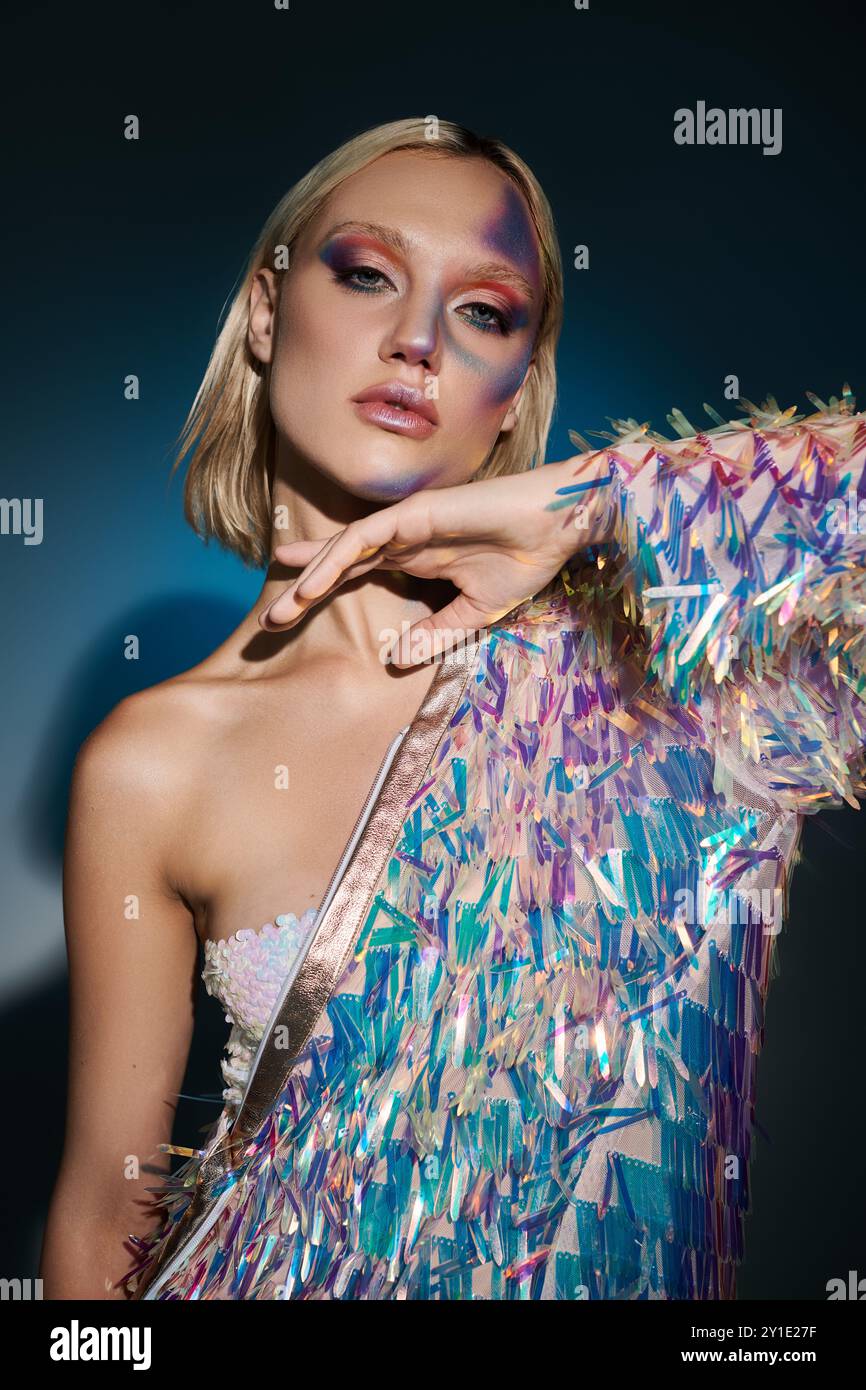 A young woman showcases a striking holographic outfit with bold makeup ...